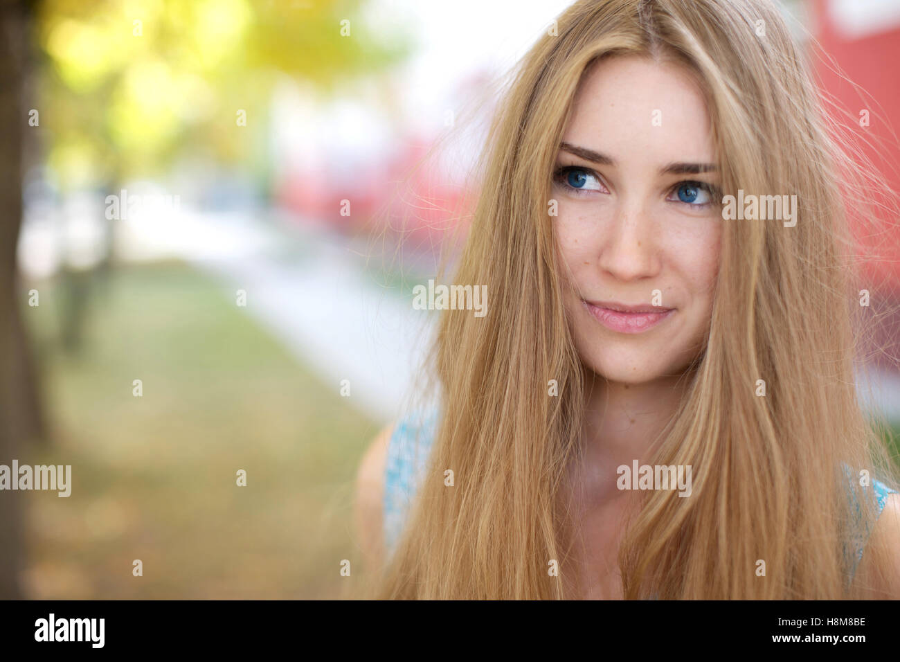 Closeup Blondie 23 year old in blue dress Stock Photo - Alamy