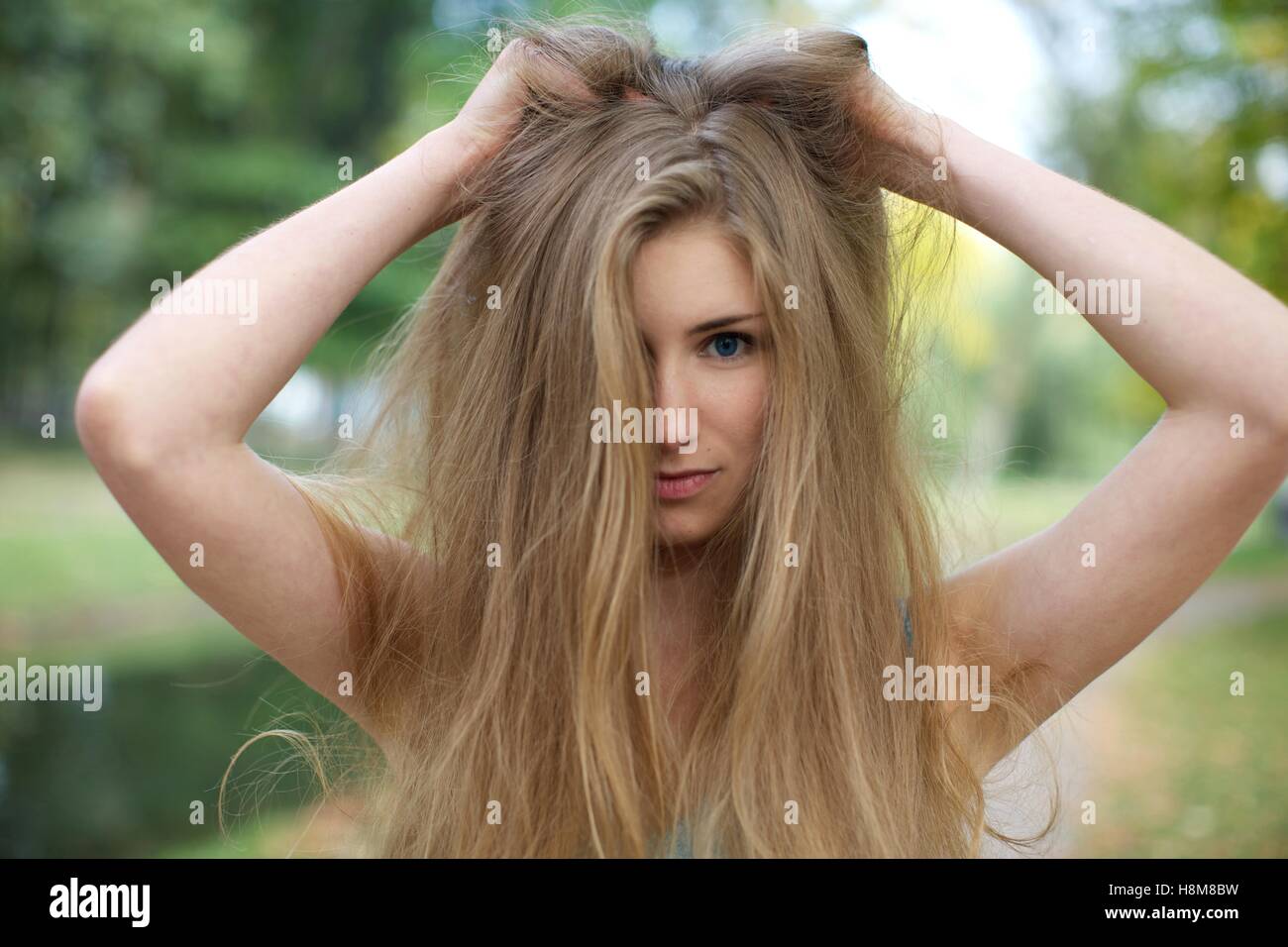 Closeup of Blue dress photoshoot 23 year old beautiful long hair blonde ...