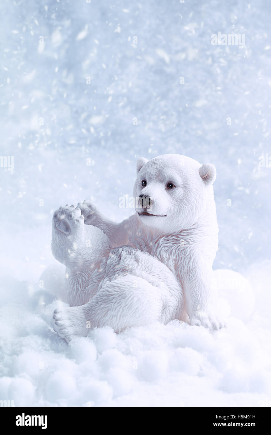 Polar bear figure in snow with cool tone Stock Photo - Alamy