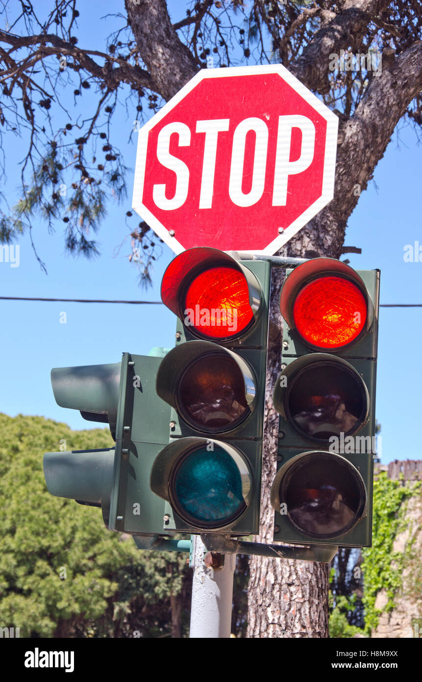 Traffic-light in street and road sign STOP Stock Photo - Alamy
