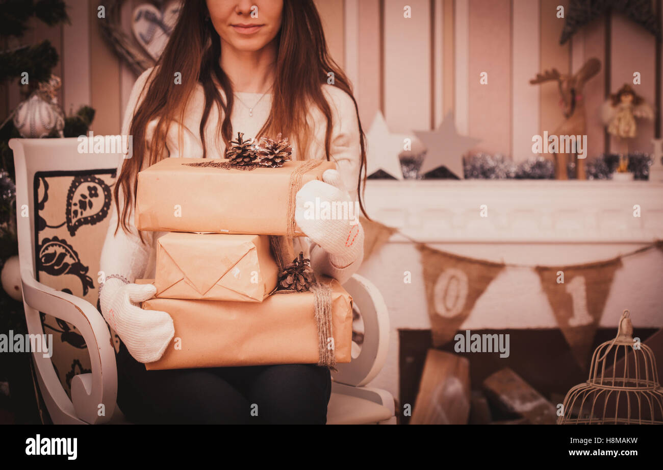 Girl with gift boxes Stock Photo - Alamy