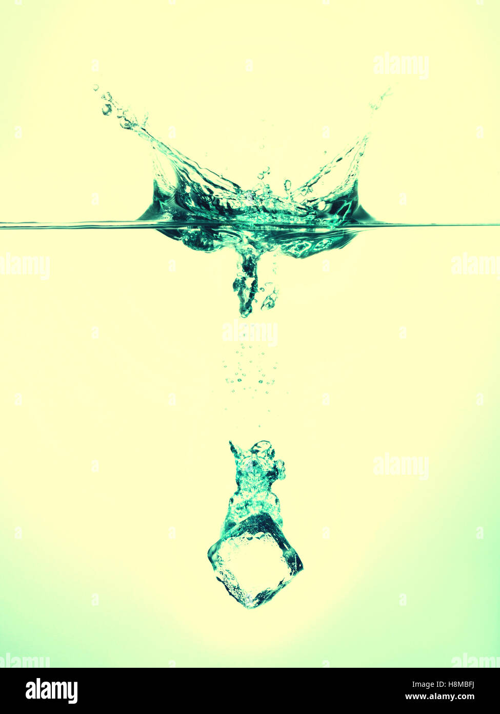 Green Ice cubes splashing Stock Photo - Alamy
