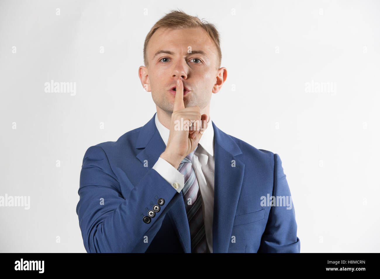 Finger over mouth shh hi-res stock photography and images - Alamy