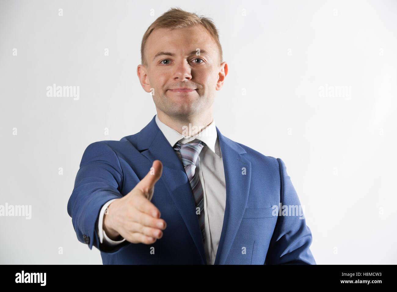 Businessman offering his hand Stock Photo - Alamy Businessman offering his hand Stock Photo - Alamy
