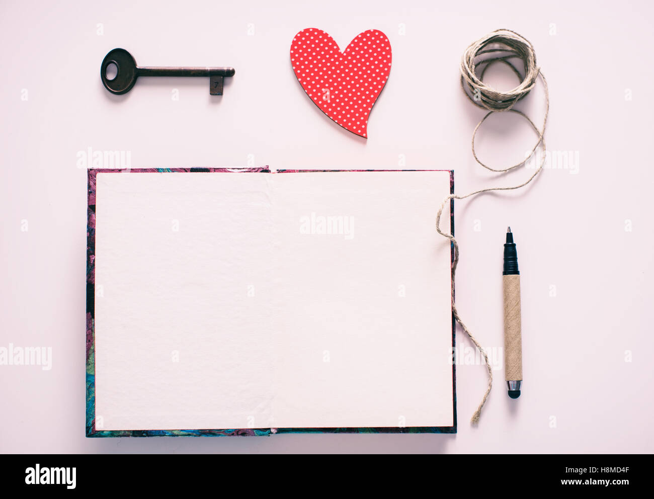 Love heart on notebook with pen Stock Photo - Alamy