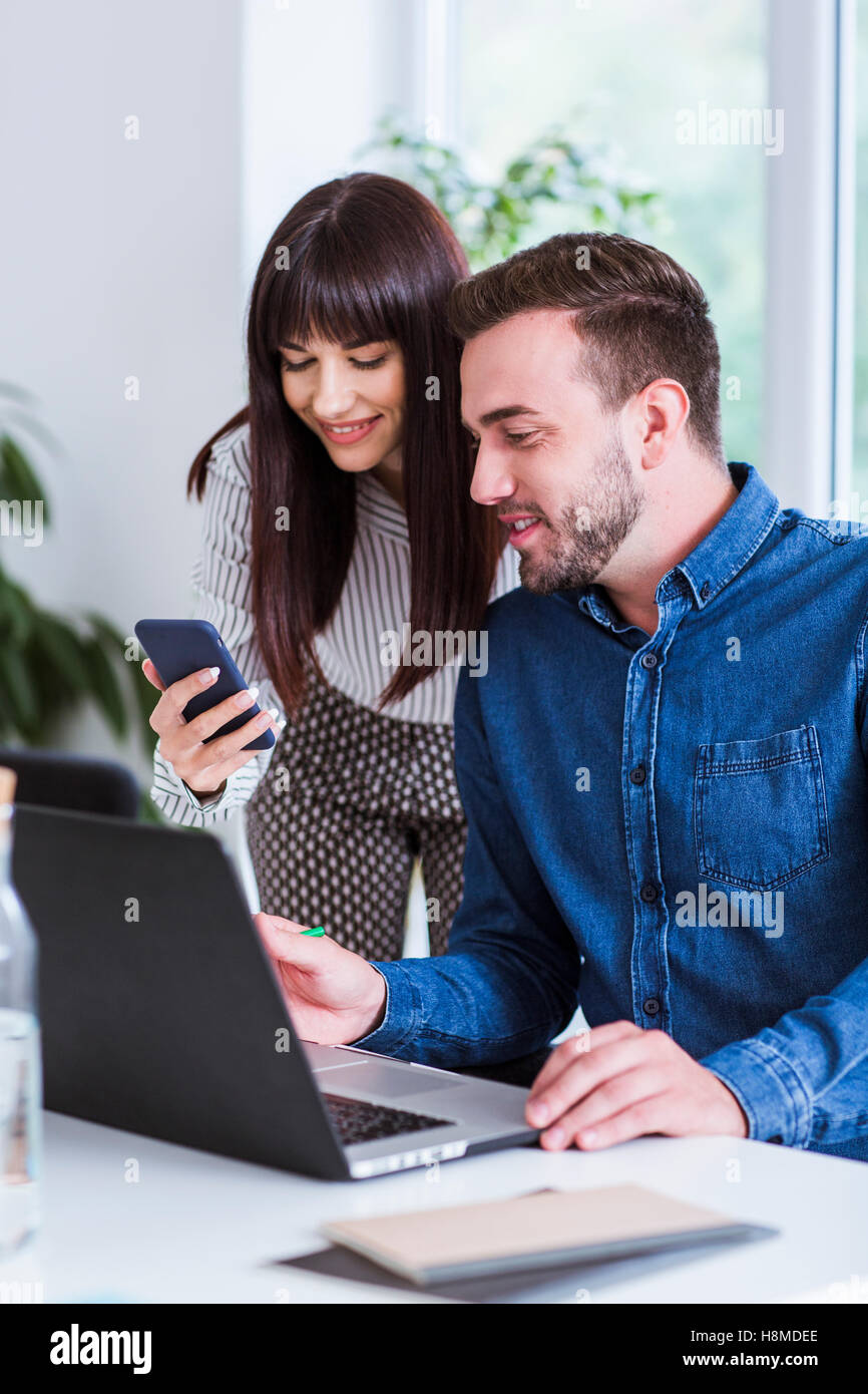 Man and Woman working in office Stock Photo - Alamy