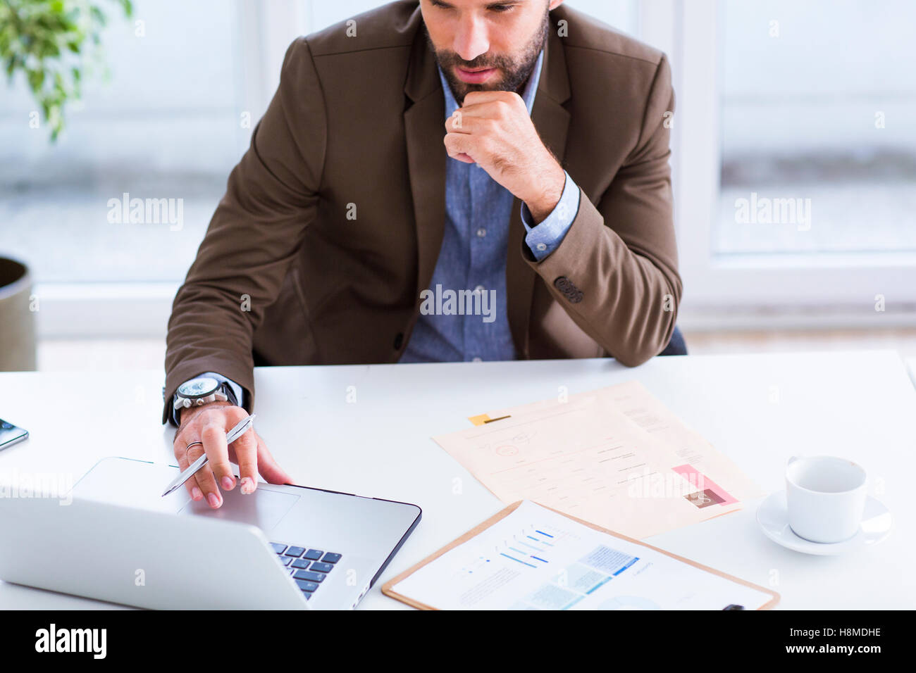 Man working in office Stock Photo - Alamy