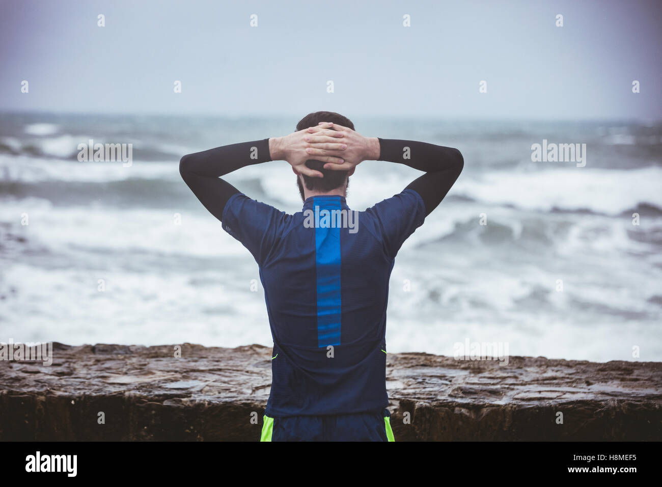 Athlete looking at sea Stock Photo - Alamy
