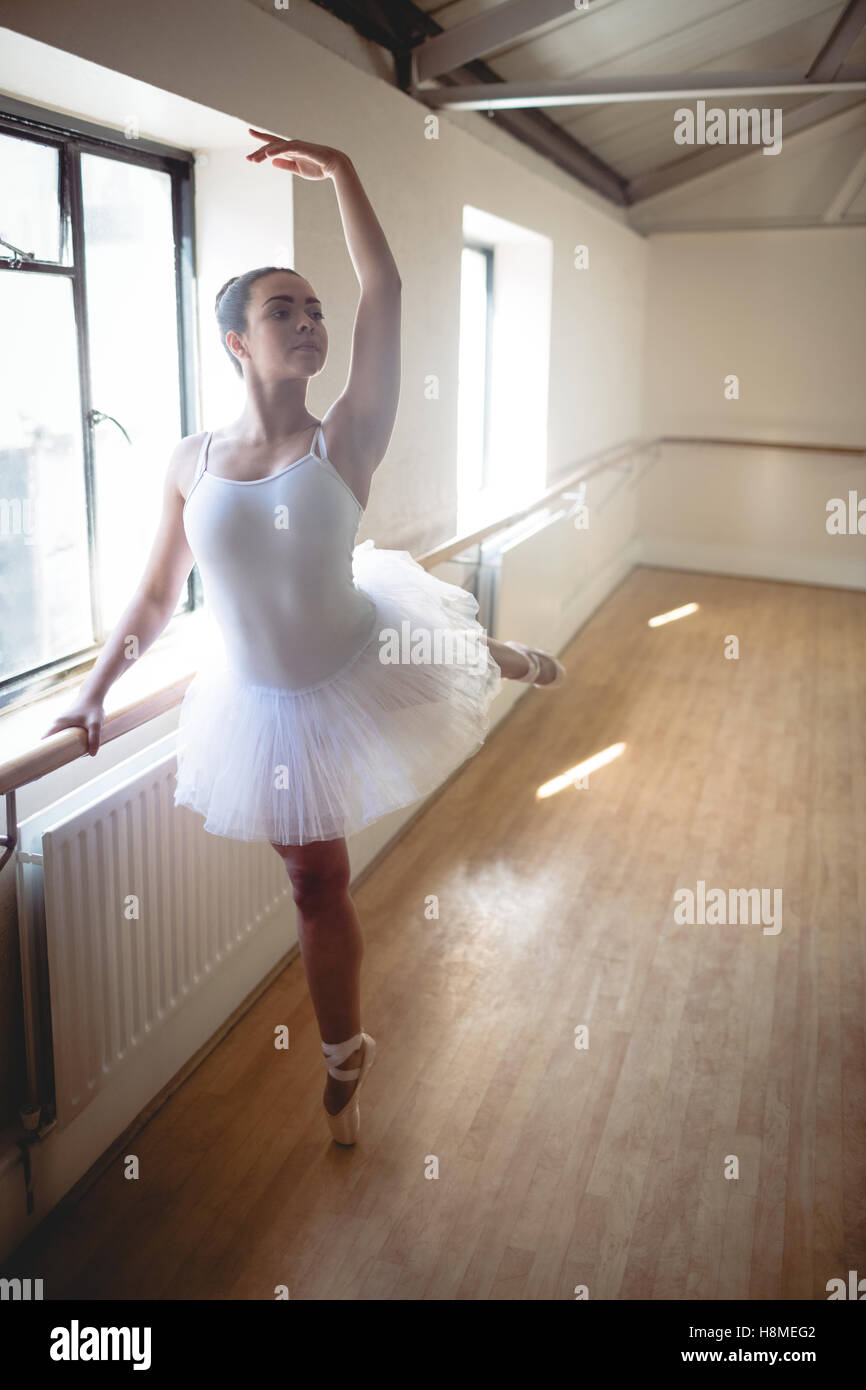 Ballerina practising ballet dance at barre Stock Photo - Alamy