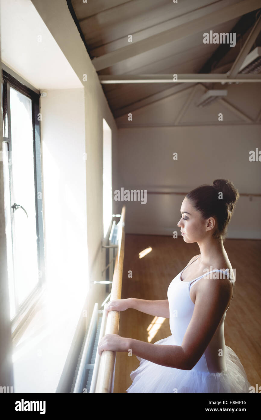 Ballerina holding the bar Stock Photo - Alamy