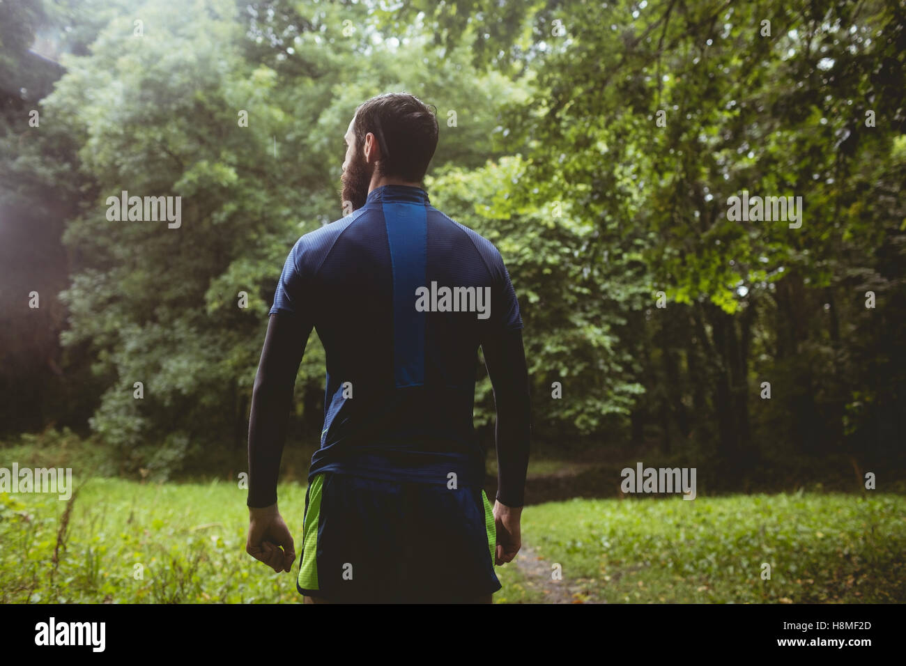 Athlete standing in forest Stock Photo - Alamy
