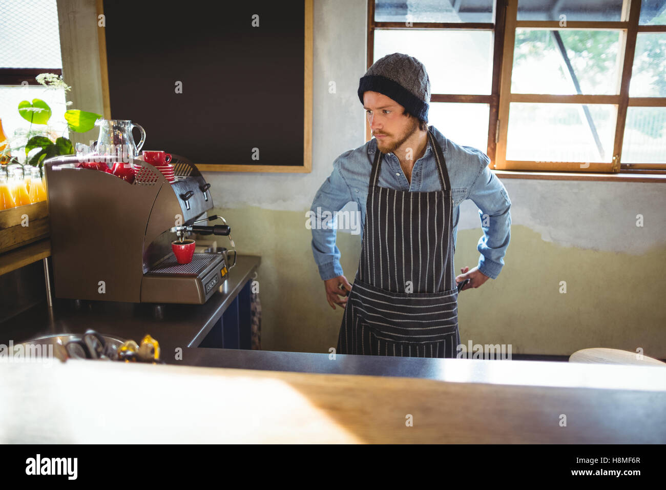 Waiter tying his apron in cafÃ© Stock Photo - Alamy