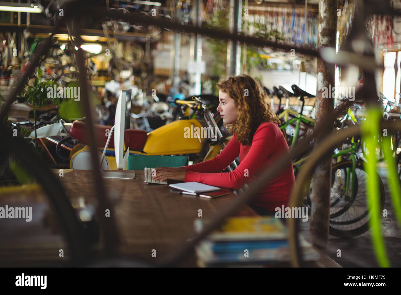Focused young woman using computer hi-res stock photography and images ...