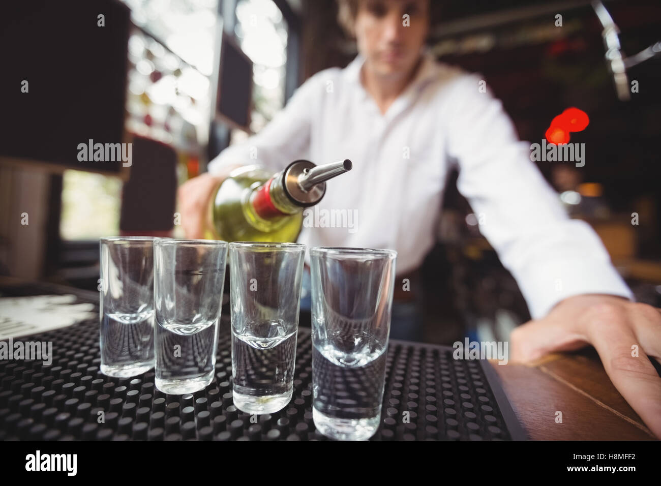 Bartender pouring bottle hi-res stock photography and images - Alamy