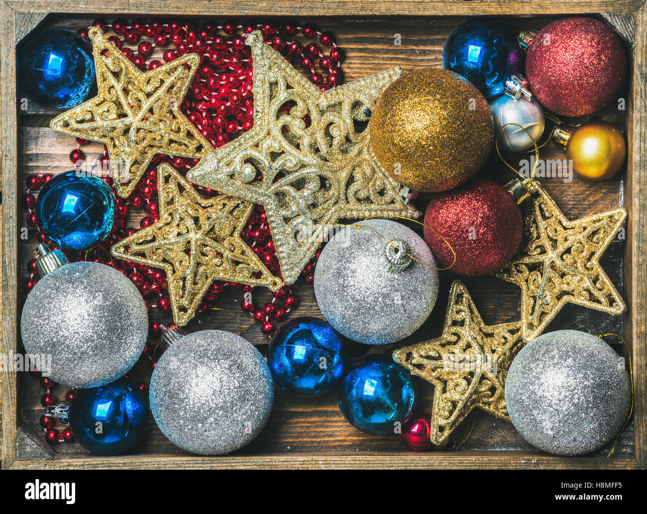 Christmas tree glittering toy stars, colorful balls and garland Stock ...