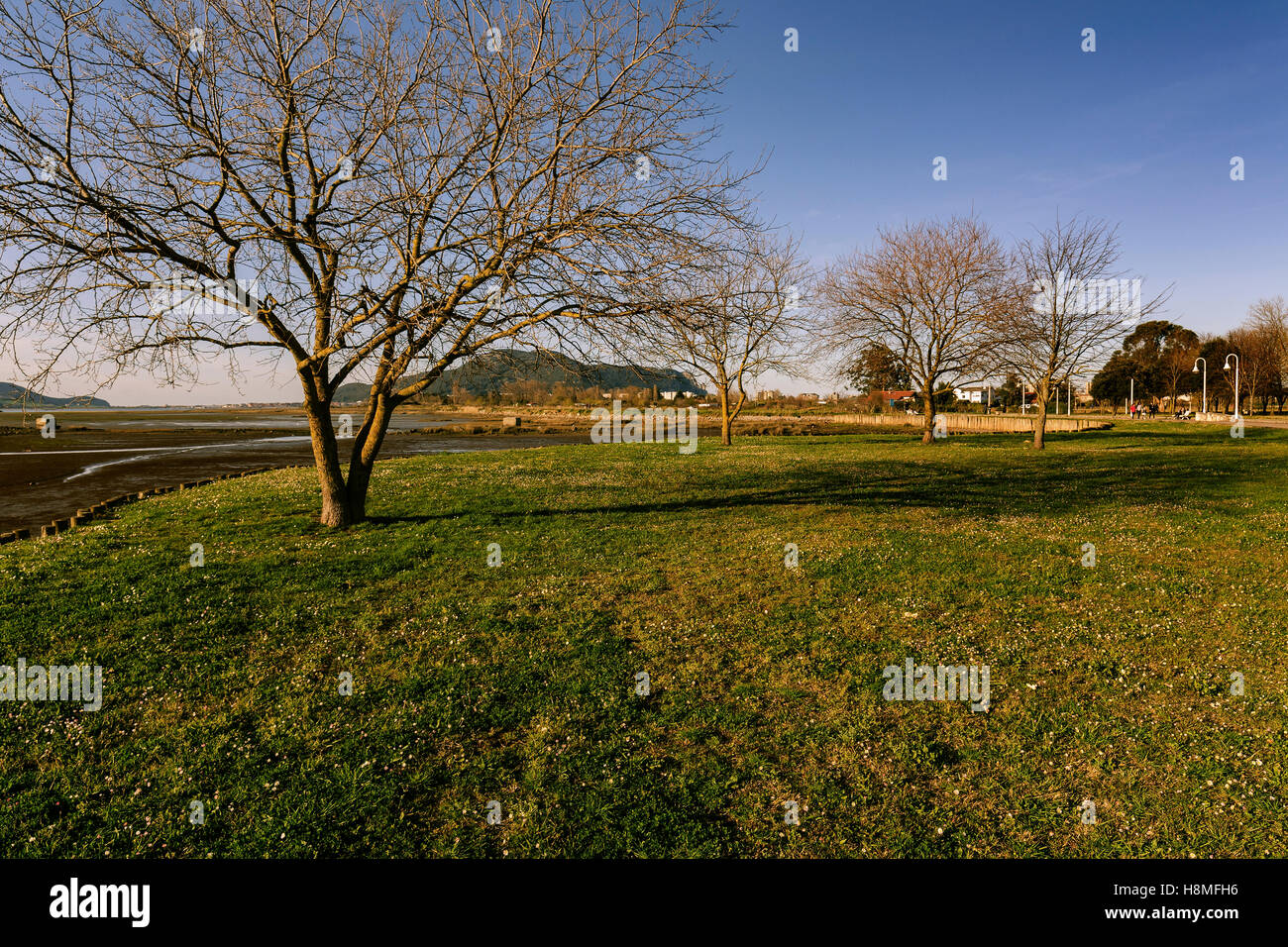 View of the promenade from the river Asón in the village of Colindres ...