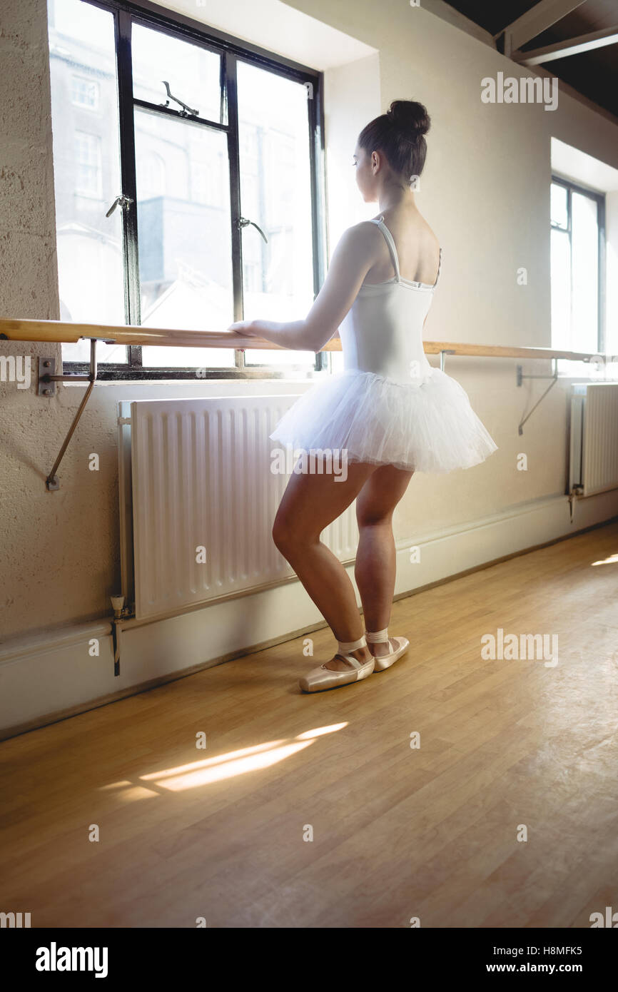 Ballerina practising ballet dance at barre Stock Photo - Alamy