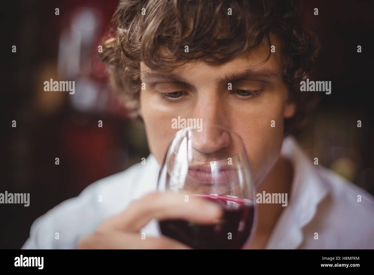 Man having a glass of red wine Stock Photo - Alamy