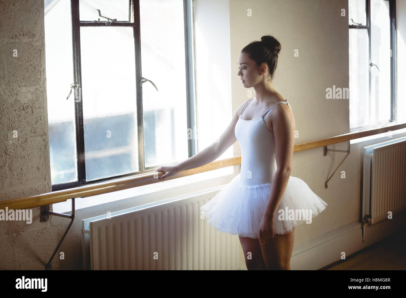 Ballerina holding the bar Stock Photo - Alamy