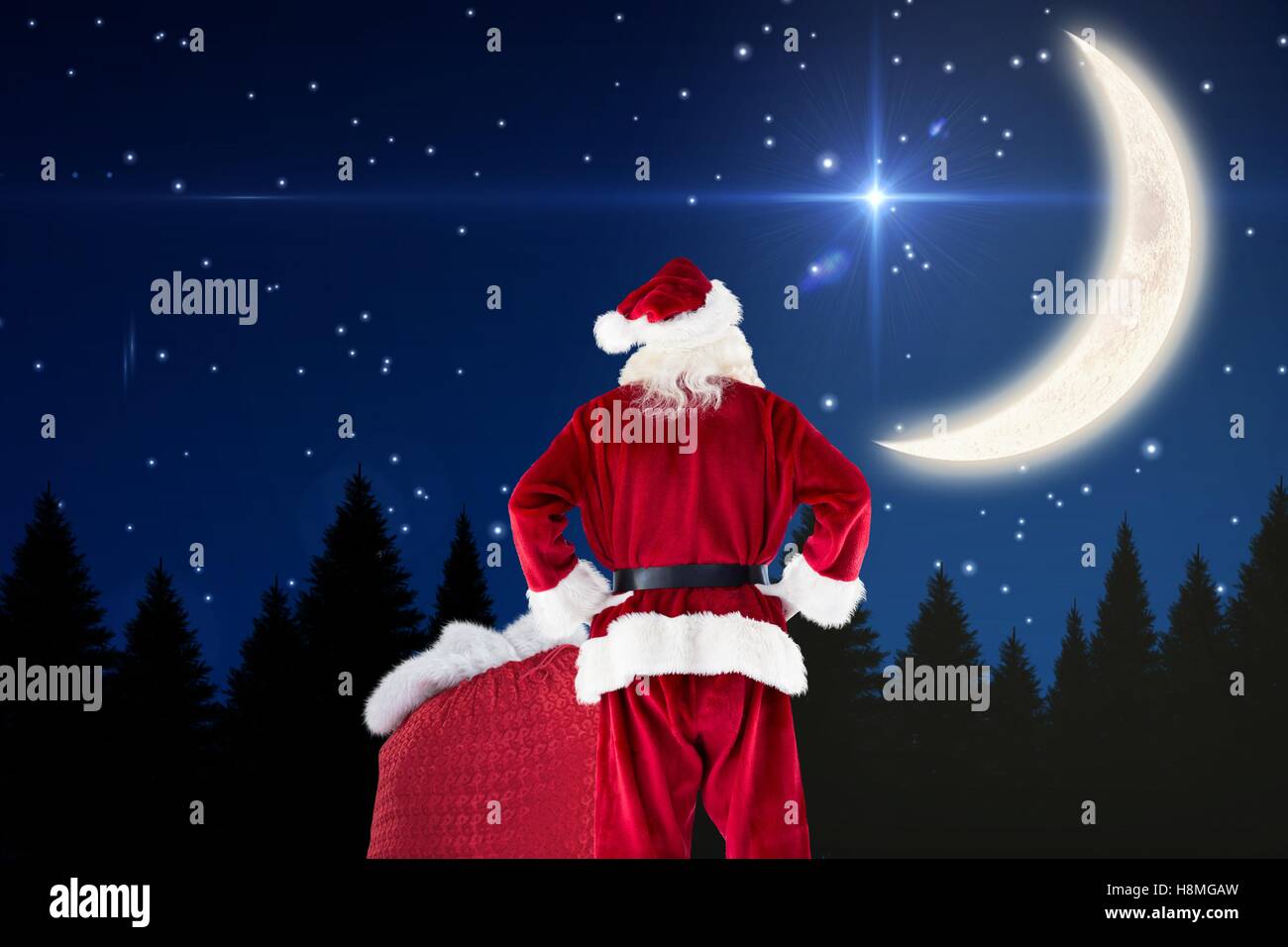 Rear view of santa claus looking at sky Stock Photo - Alamy