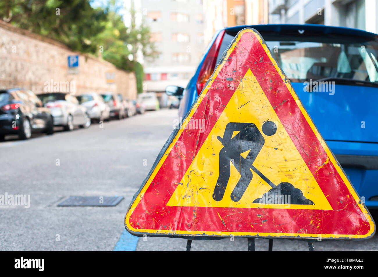 Road signs in a street under reconstruction symbol Stock Photo - Alamy