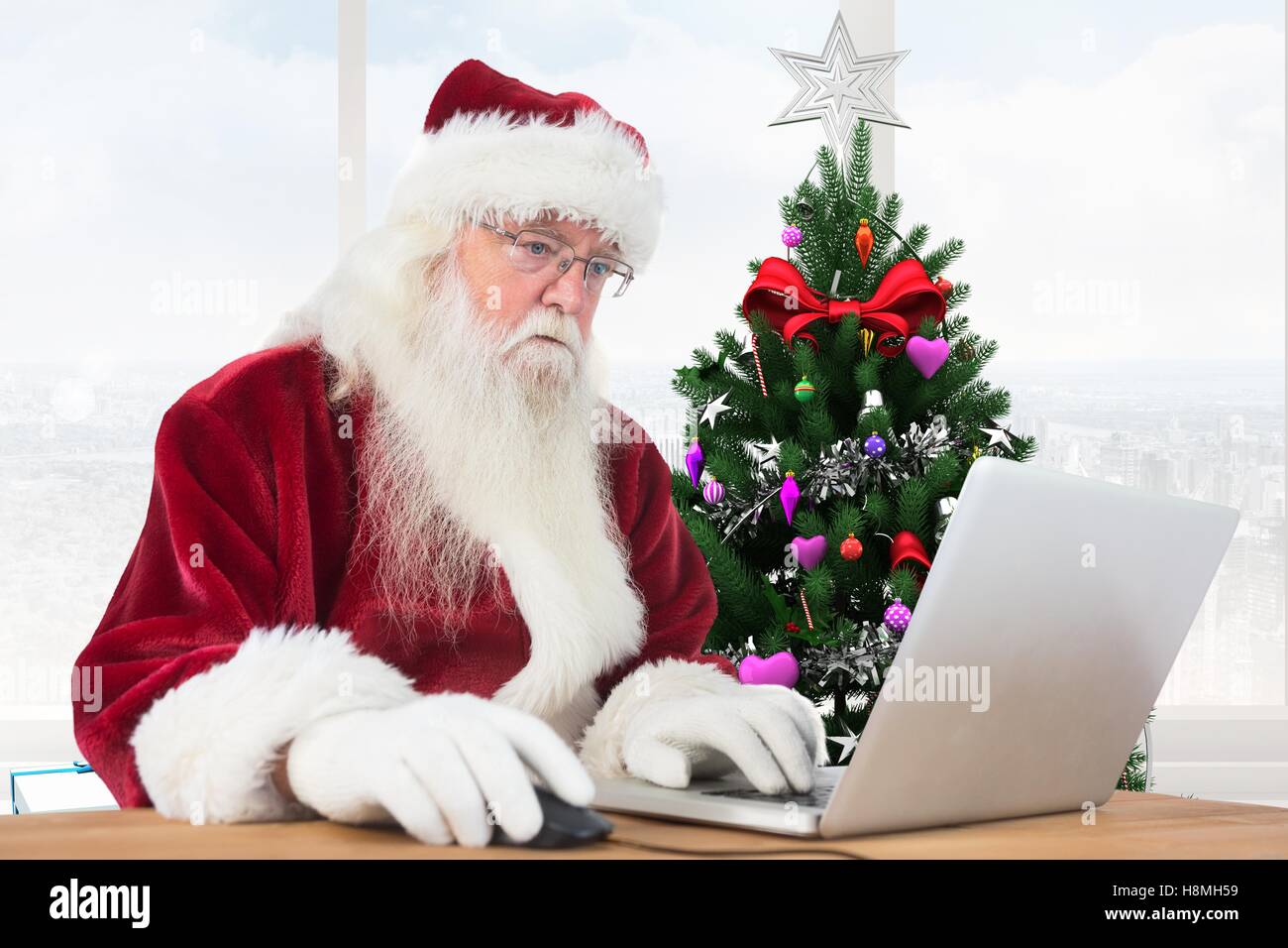 Santa claus using laptop computer hi-res stock photography and images ...