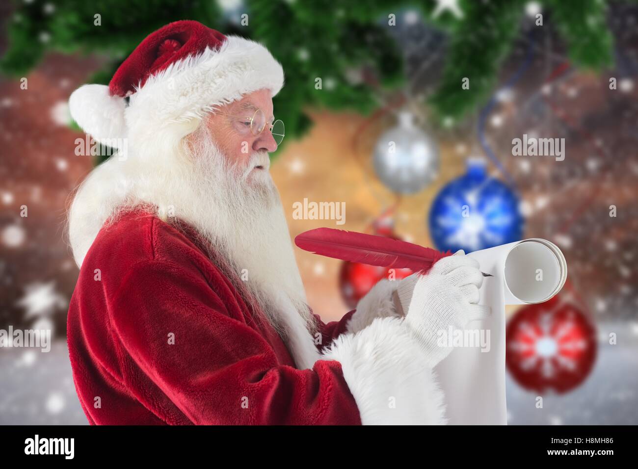 Santa claus writing with a quill Stock Photo - Alamy