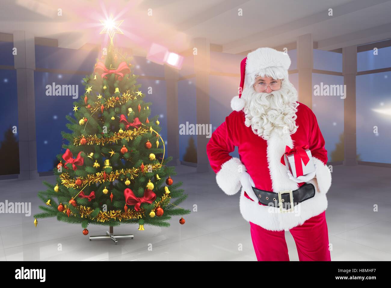 Father christmas holding gift hi-res stock photography and images - Alamy