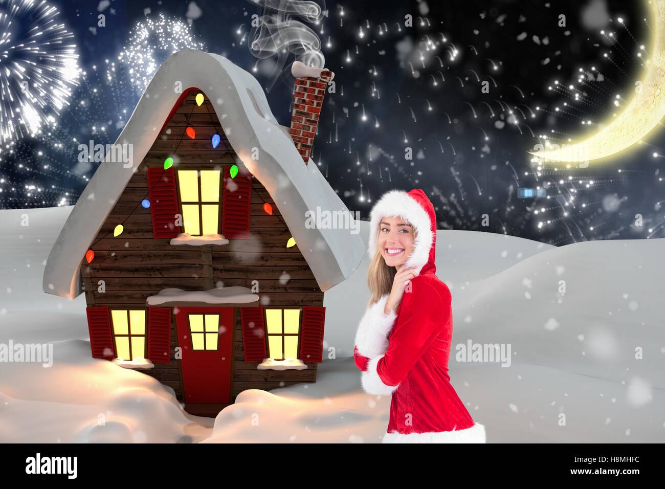 Beautiful woman in santa costume standing against digitally generated ...
