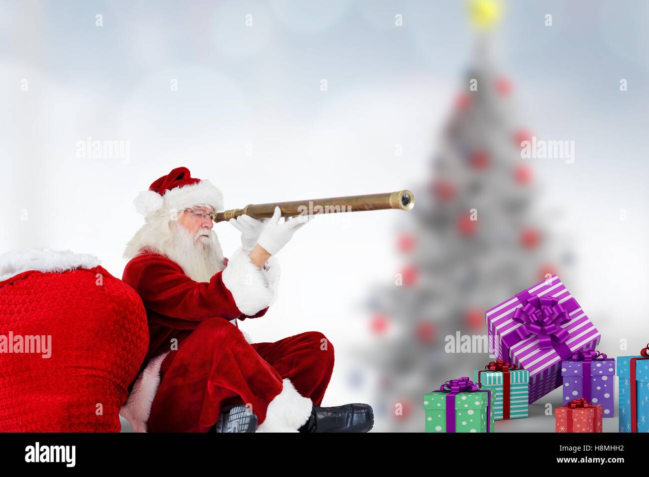 Santa claus looking through binoculars Stock Photo - Alamy