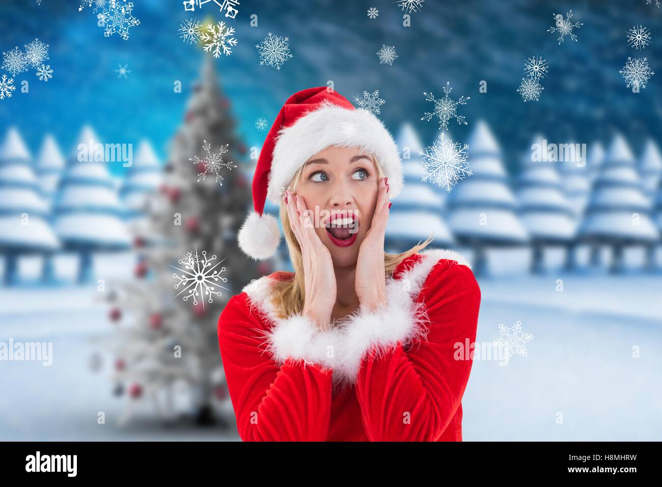 Surprised woman in santa costume Stock Photo - Alamy