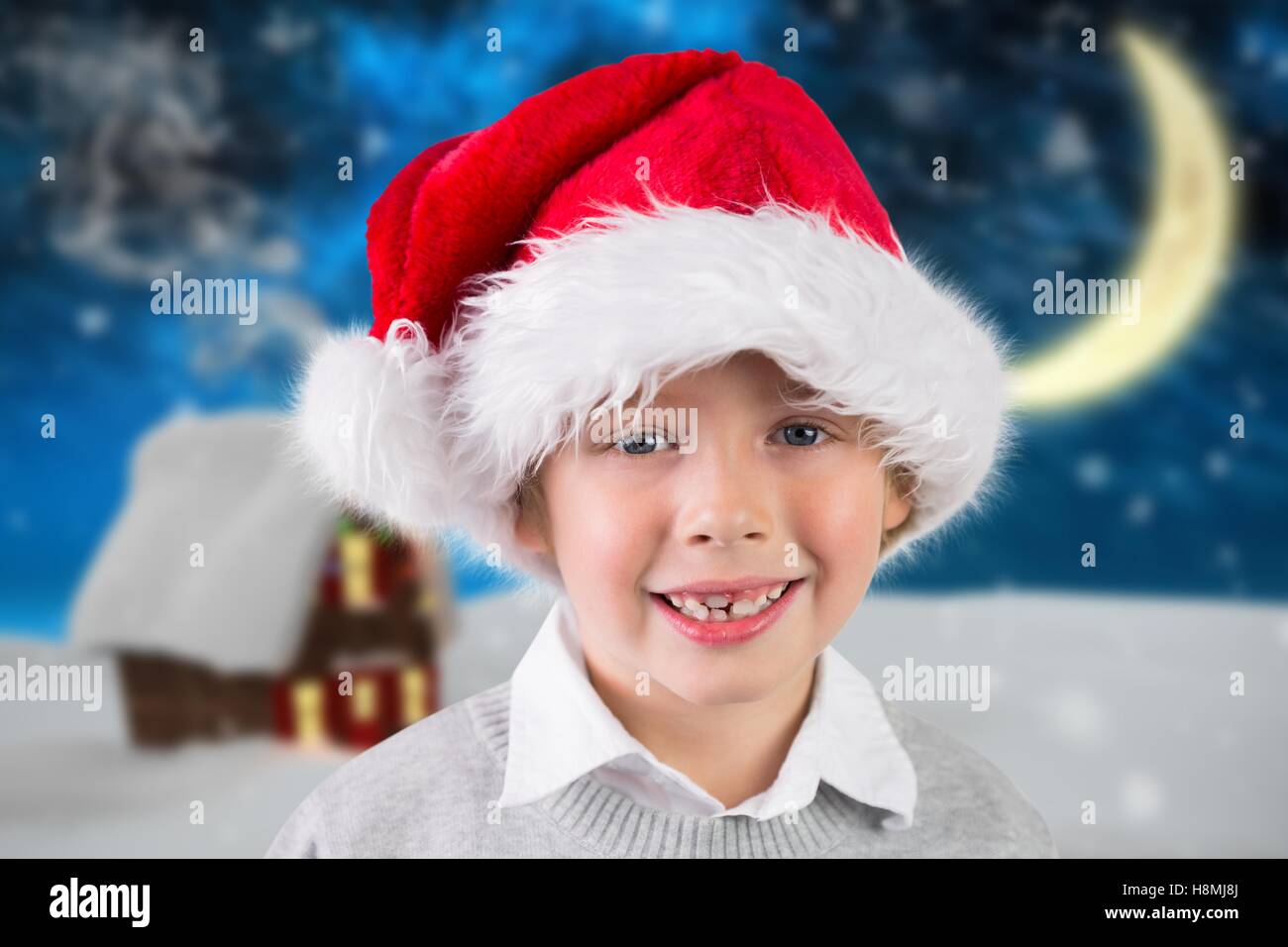 Boy in santa hat smiling at camera Stock Photo - Alamy
