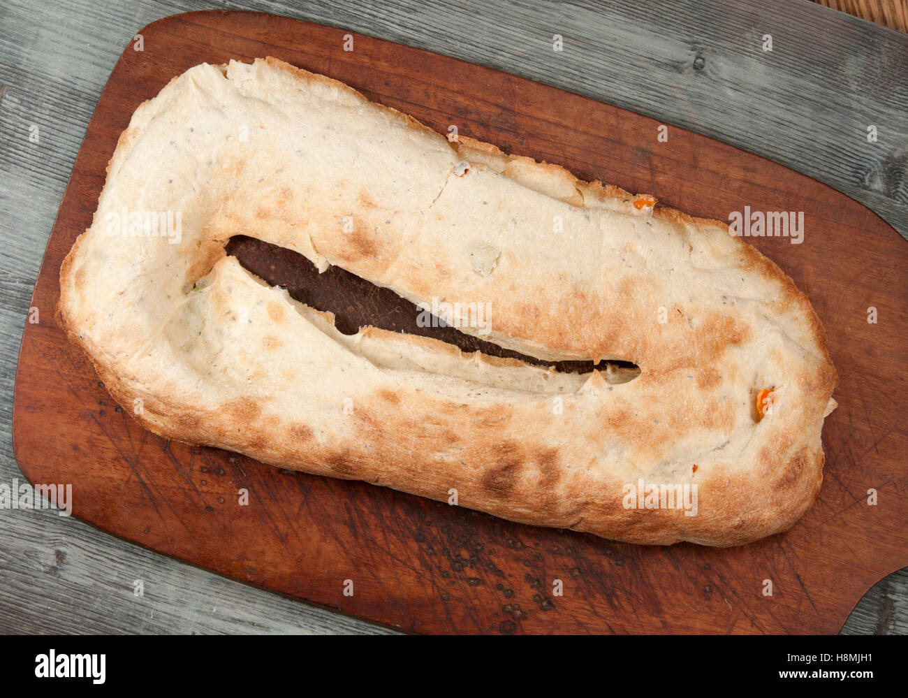 Georgian lavash with greenery and paprika on board Stock Photo - Alamy