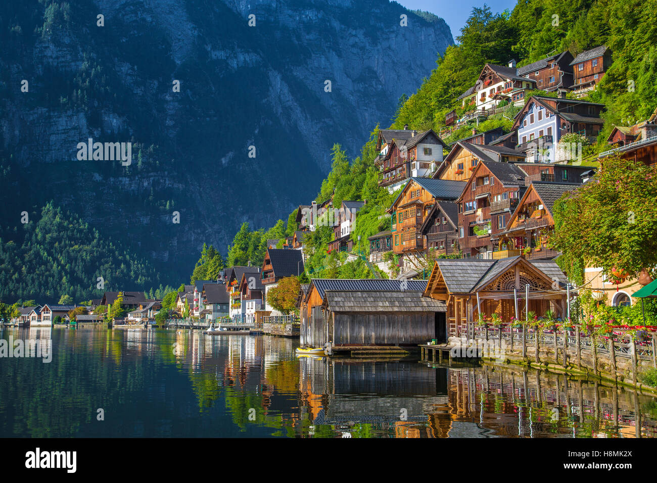 Classic postcard view of famous Hallstatt lakeside town in the Alps in beautiful morning light ...