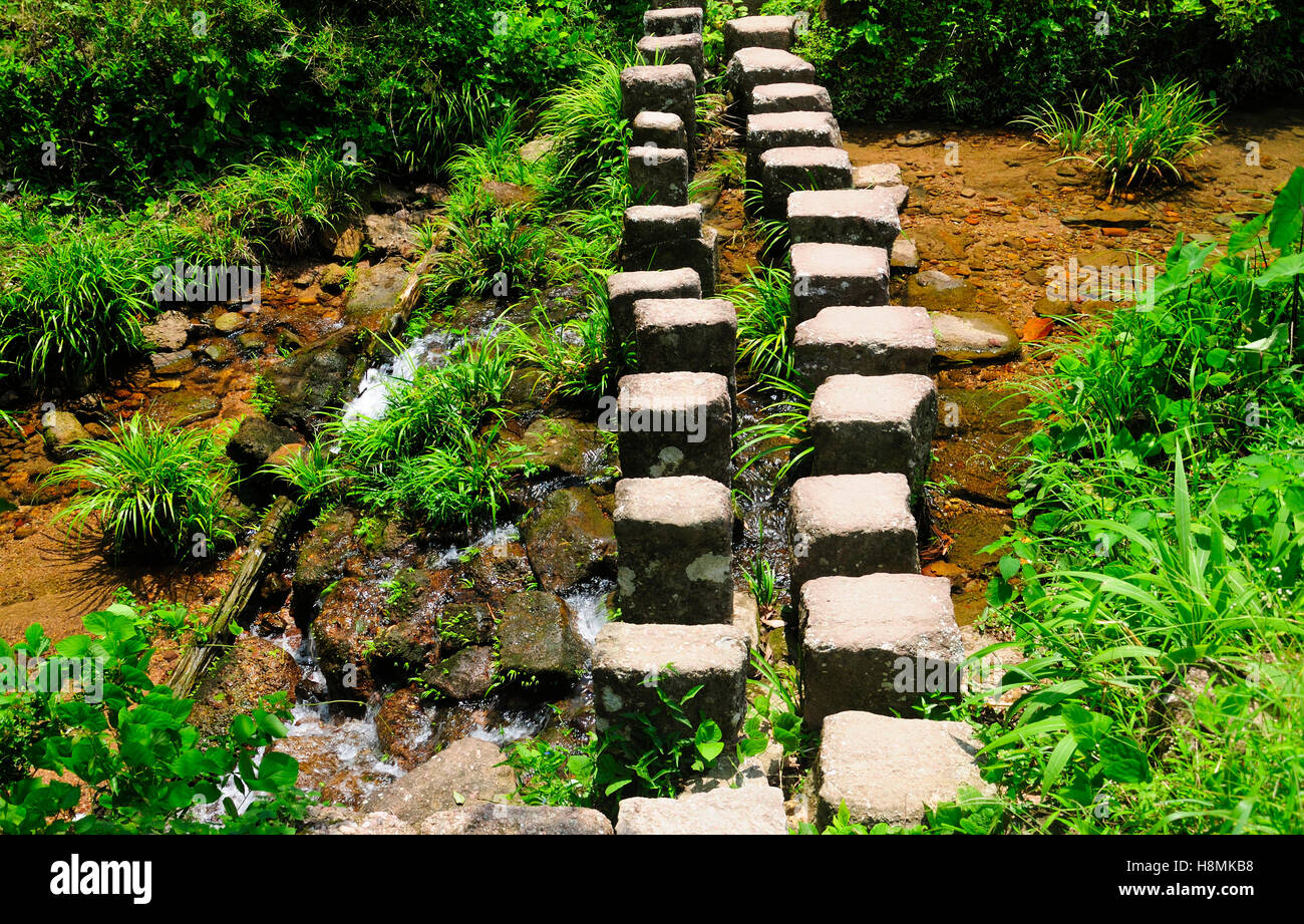 Stepping across rocks hi-res stock photography and images - Alamy