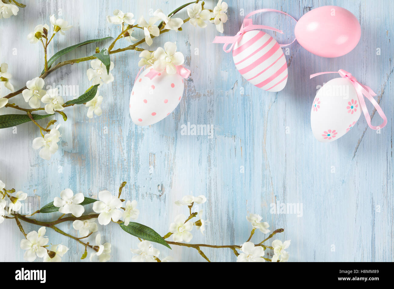 Spring flowers and colorful Easter eggs frame Stock Photo - Alamy