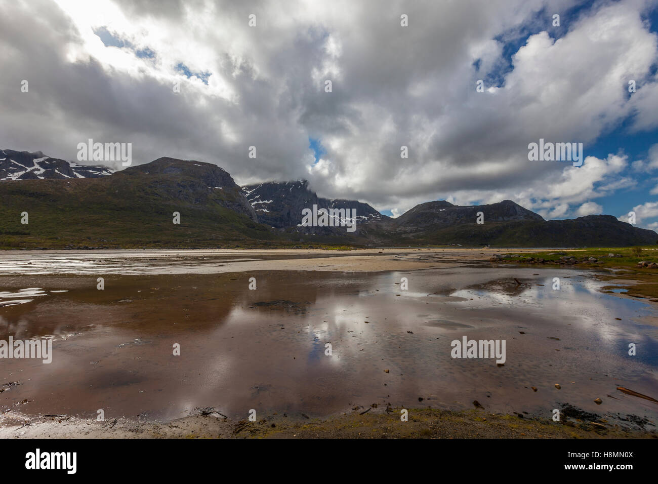 Reflections on the beach at Kilan near Flakstad, Lofoten Islands ...