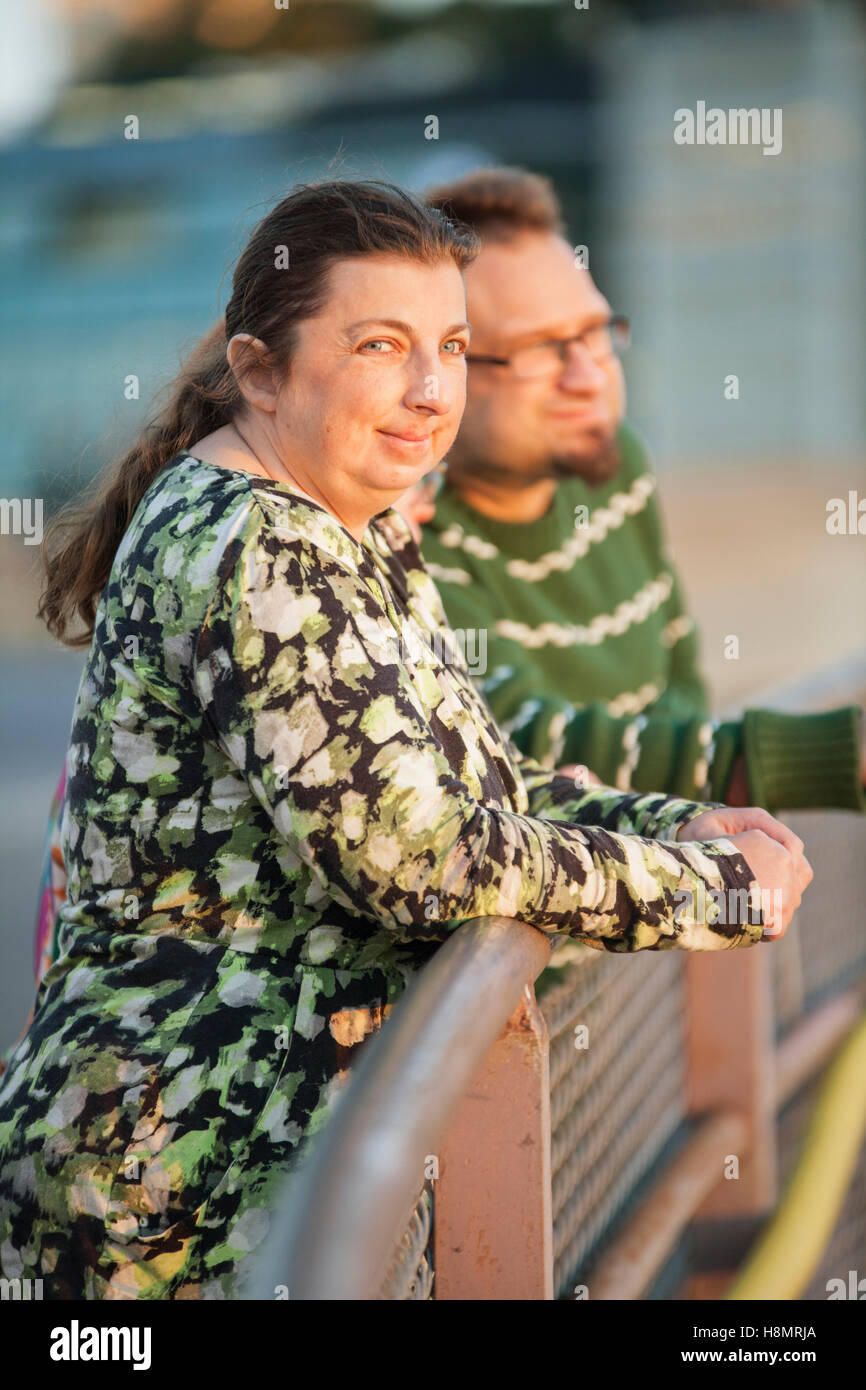 Leaning against railing hi-res stock photography and images - Alamy