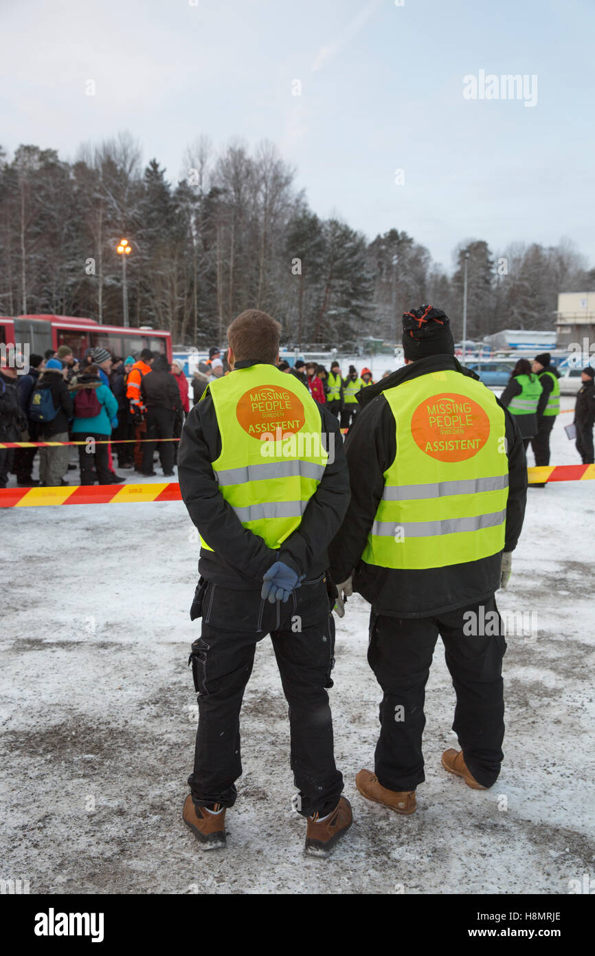 Rescue workers of Missing people organization looking at crowd, Sweden ...