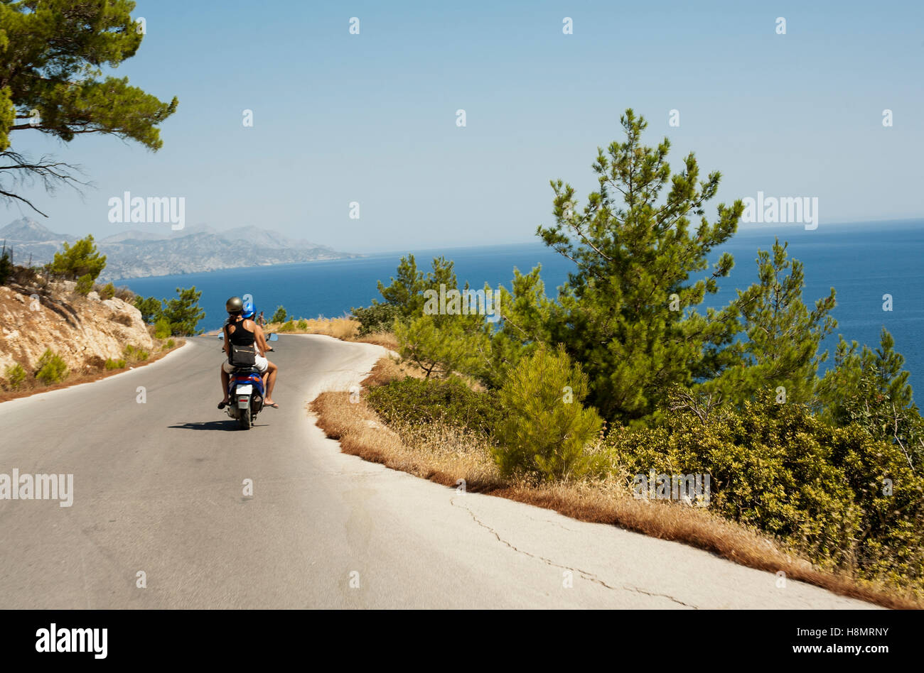 Two women with motor scooter hi-res stock photography and images - Alamy