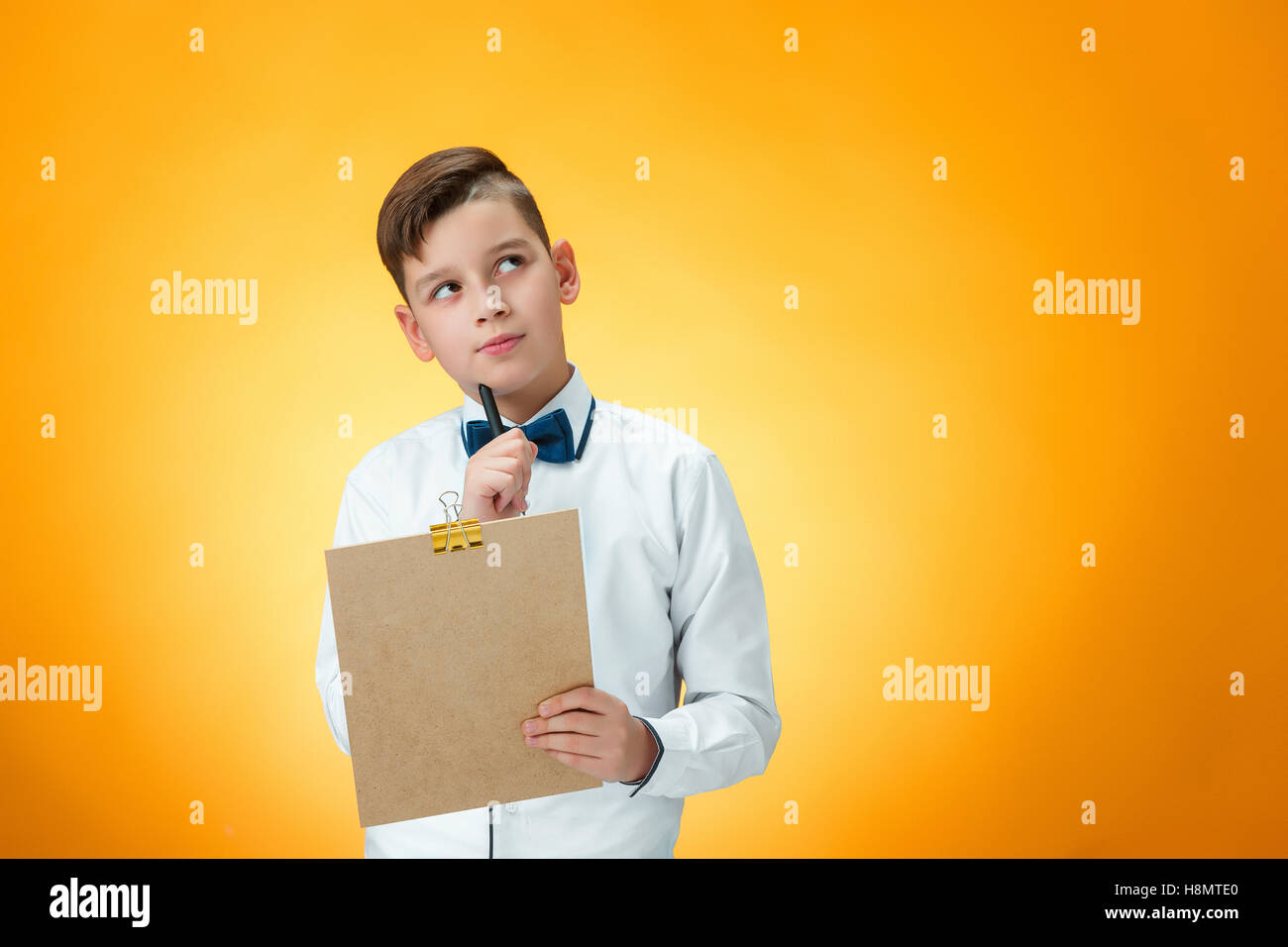 The boy with pen and tablet for notes Stock Photo - Alamy