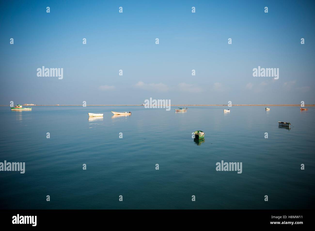 Fishing boats in calm water of the harbour of Berbera. (Photo from ...