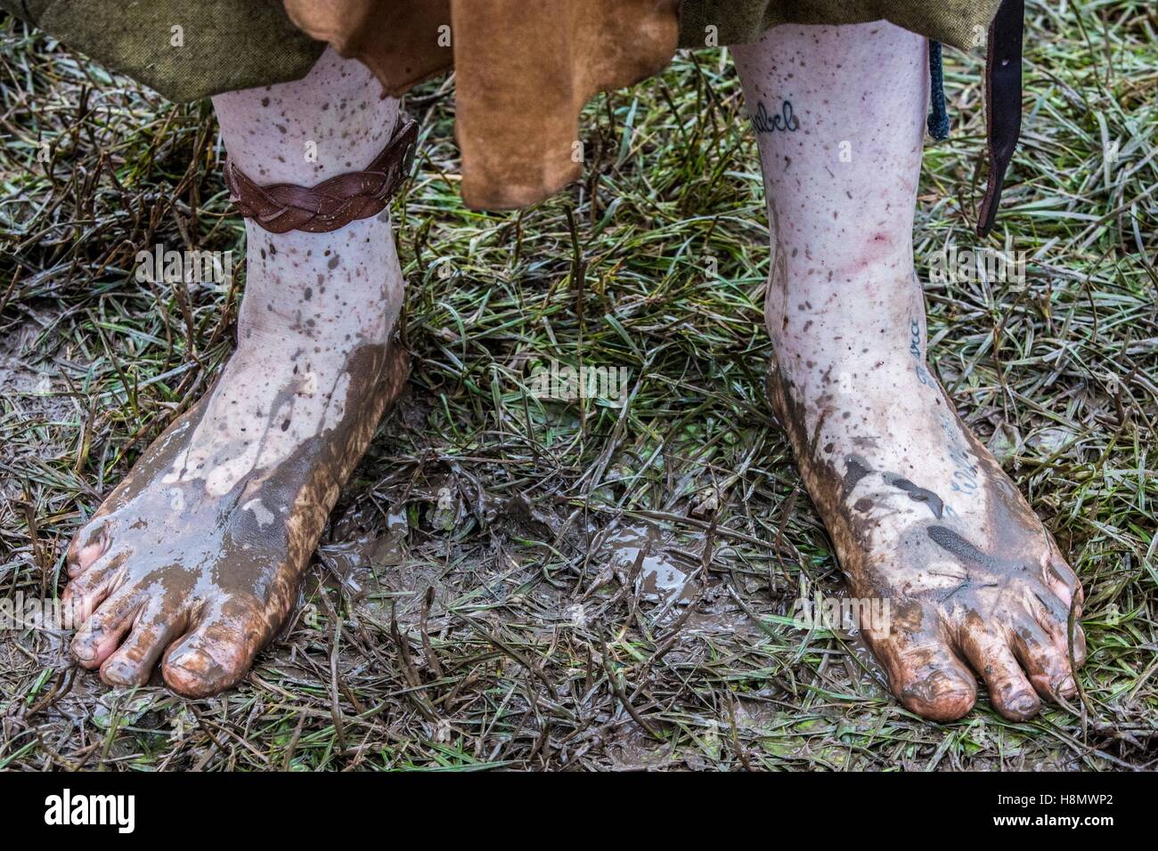 Muddy female feet on muddy ground at a medieval market, Waiblingen ...