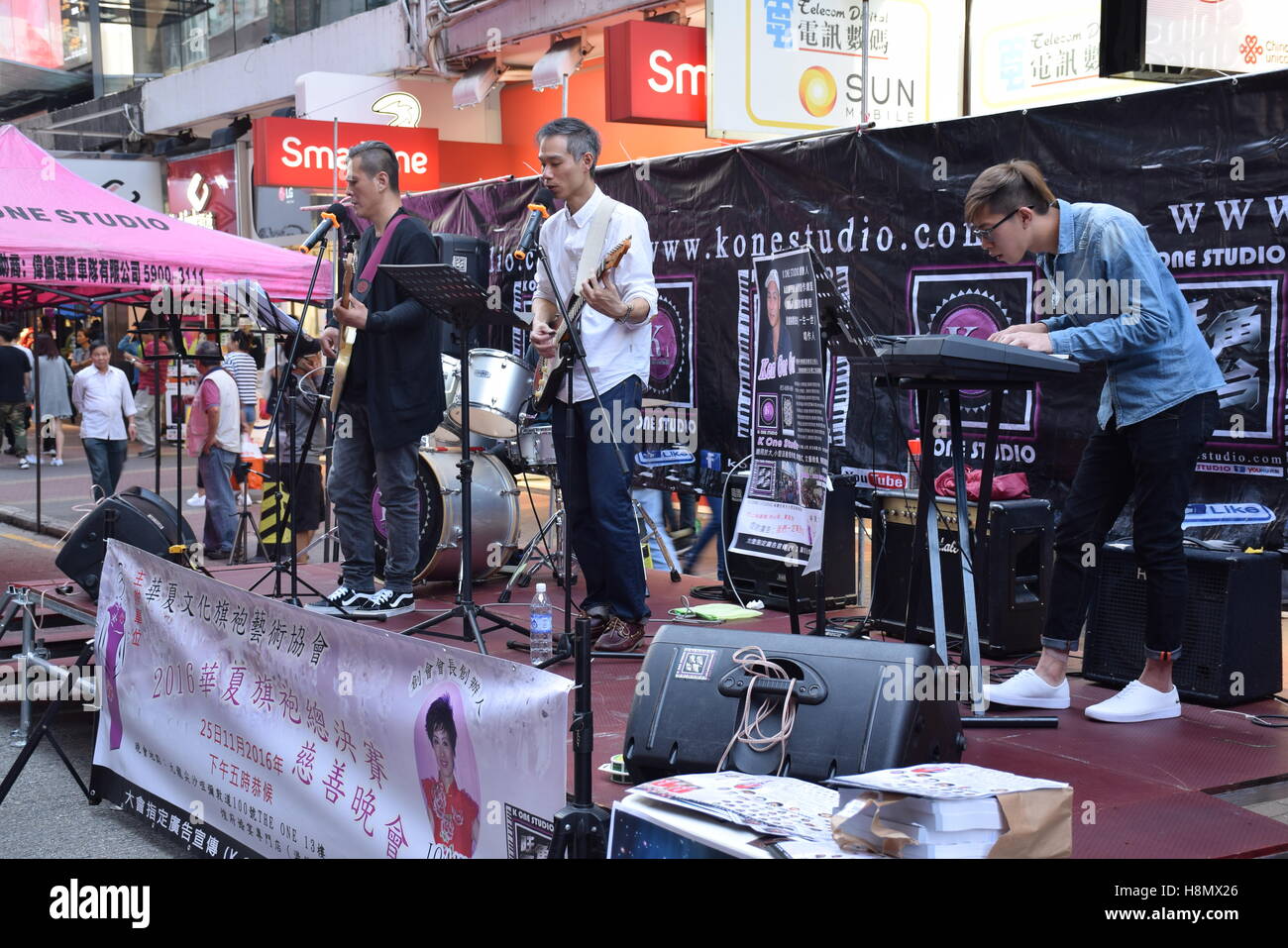 Hong Kong, China - Asian music band performing on stage in the street ...