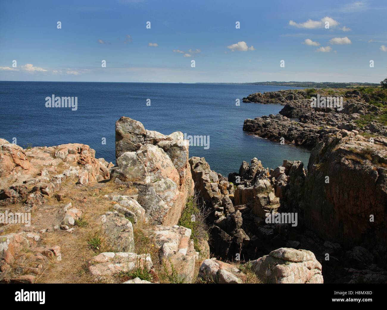Rocks are seen east of the city of Gudhjem at the northern shore of the ...