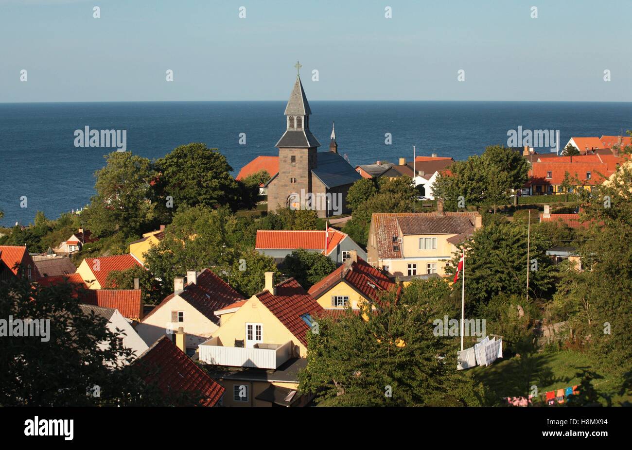 A view over the small city of Gudhjem in the north of the island of ...