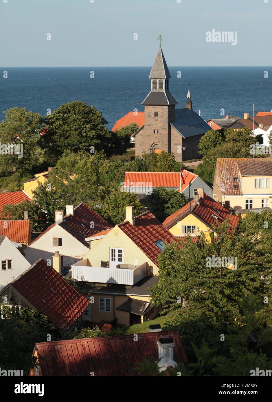 A view over the small city of Gudhjem in the north of the island of ...