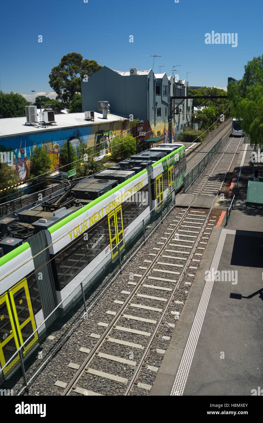 trams and tram stop on 86 line in south melbourne Stock Photo - Alamy