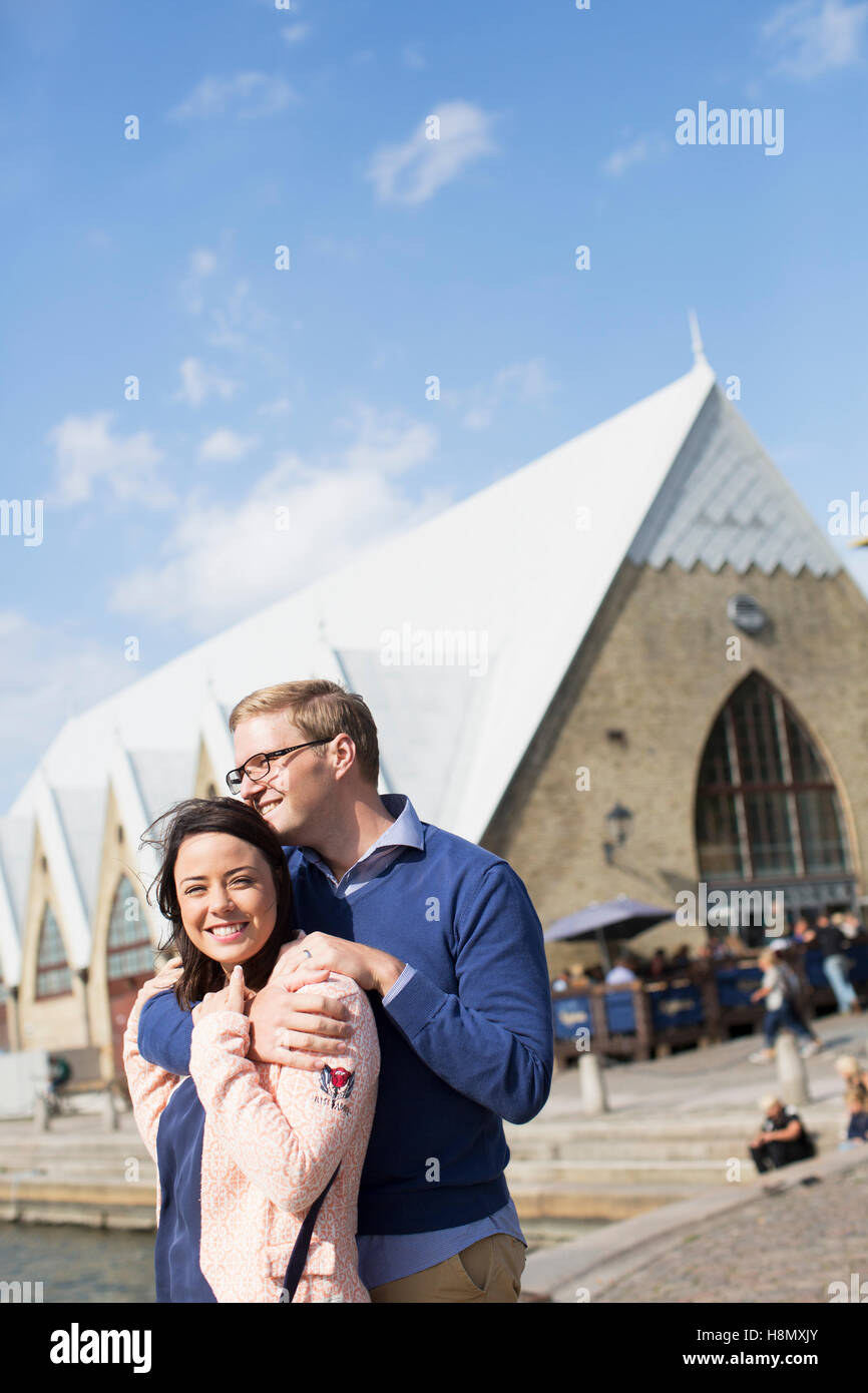 Smiling young couple on promenade Stock Photo - Alamy