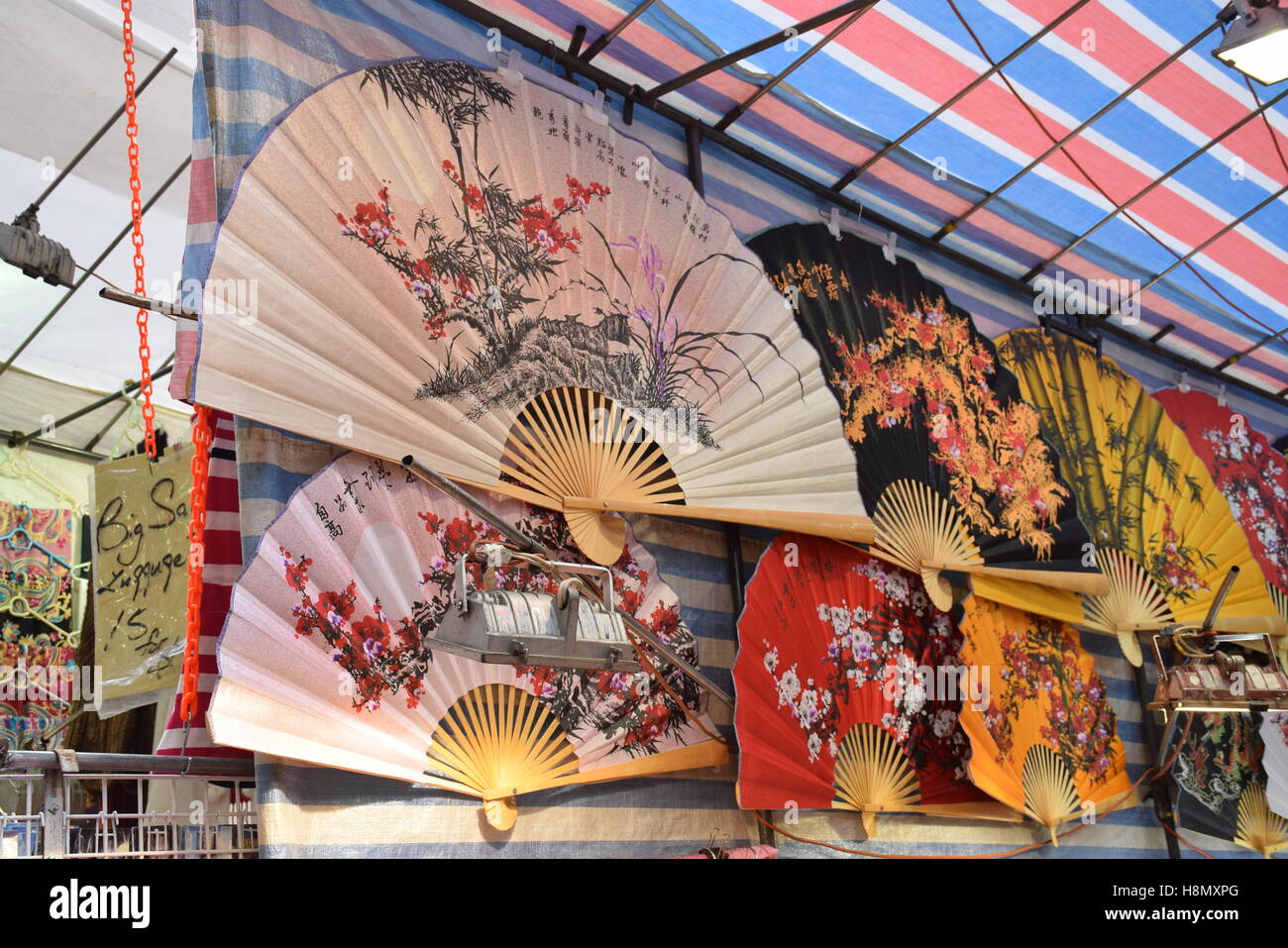 Typical decorated chinese fans in a market stall in Hong Kong, China ...